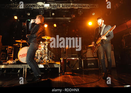 Andy Nicholson, bass guitar with the Arctic Monkeys performs on stage ...