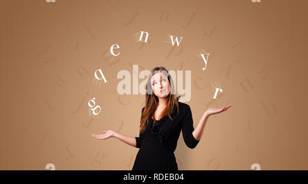 Young student juggle with letters Stock Photo - Alamy