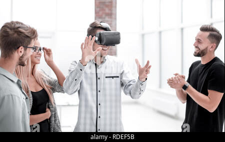 Young doctor watching male in VR goggles Stock Photo - Alamy