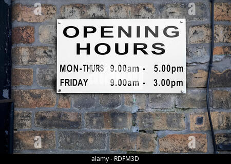 Opening hours shop sign Monday to Friday daytime closed Sunday Stock ...