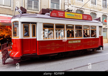 Typical red Tram in Lisbon street, Portugal Stock Photo - Alamy