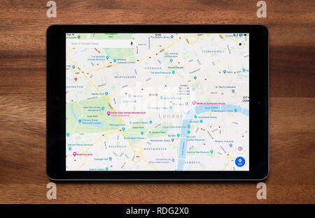 The website of Google is seen on an iPad tablet, which is resting on a ...