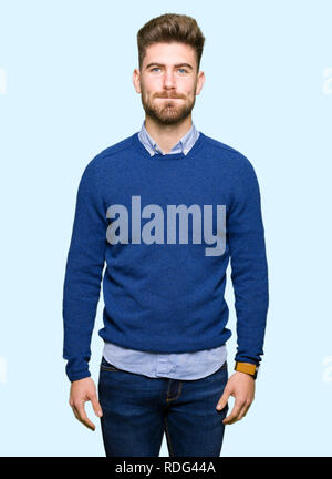 Young handsome bussines man puffing cheeks with funny face. Mouth ...