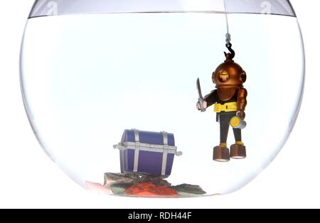 Toy deep sea diver with a treasure chest in a fish bowl, illustration ...