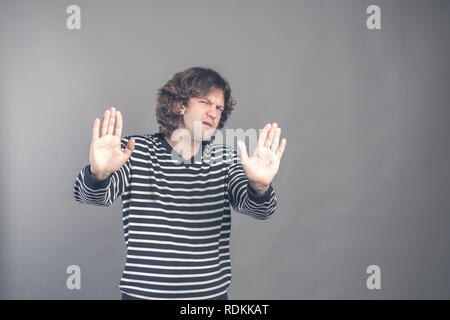 Male shows refusal gesture, does not want to participate in christmas ...