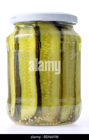 Gherkin slices, pickled in a glass jar. Lengthwise sliced gherkins ...