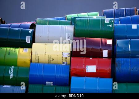 Empty metal drums used for chemicals stockpiled in a recycling company ...