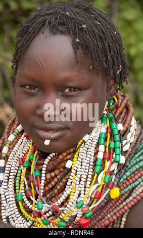 Nyangatom woman with bead necklaces, Bume, Buma, Bumi, breastfeeding ...