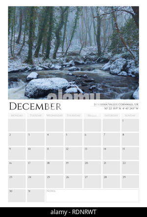 Simple 2019 December monthly calendar on table with office supplies ...