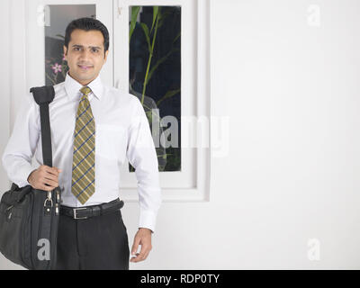 Portrait of young man ready to go to work Stock Photo - Alamy