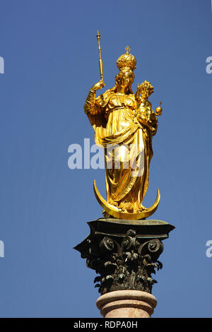 Golden Statue of Holy Mary in the Marienplatz in Munich city in Germany ...