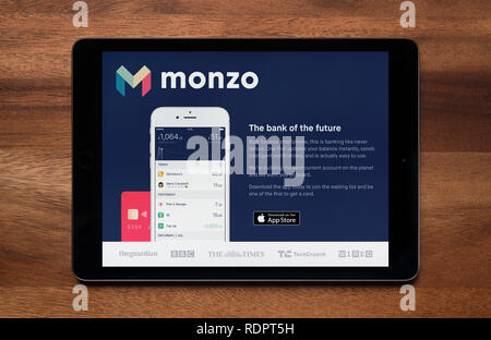 Monzo logo and website seen on phone and a computer screen Stock Photo ...