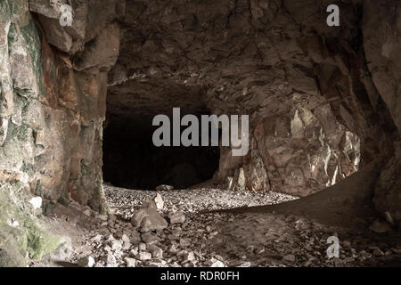 In the corridors of a creepy dark cave Stock Photo - Alamy