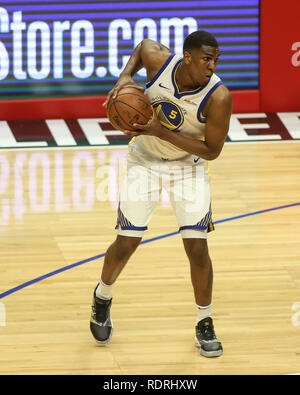 Golden State Warriors forward Kevon Looney, left, shoots against the ...
