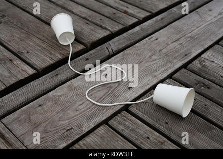 Paper cup and string phone Stock Photo - Alamy