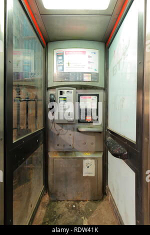 A public telephone inside a BT phone booth england uk Stock Photo - Alamy