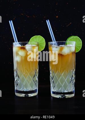 Dark n Stormy highball cocktail served as a long drink with rum, fresh lime juice, and ginger ...