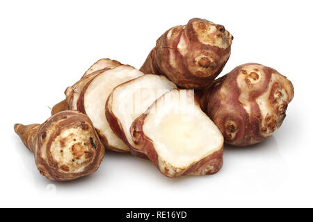 Jerusalem artichoke or sweet potato with slices and leaf isolated on ...