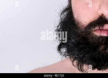 A part of a long ungroomed beard with long, messy and untrimmed hair ...