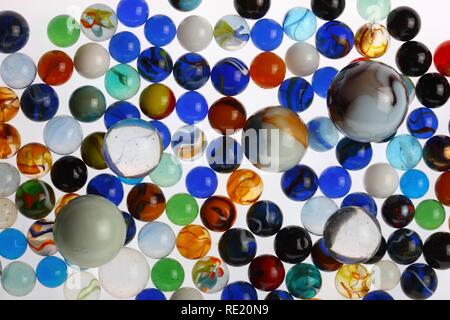 Glass marbles, different colours and sizes, in a carry net Stock Photo ...