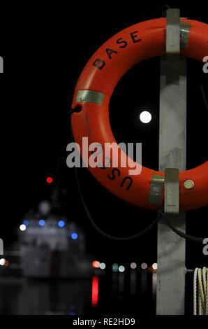 The supermoon shines over Coast Guard Cutters Sea Horse, Legare ...