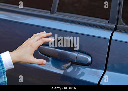 Children hand opening car door. Stole service concept. Criminal ...