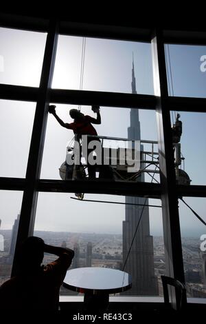 Window cleaners at work on Burj Khalifa, the world's tallest building ...
