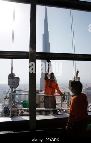 Window cleaners at work on Burj Khalifa, the world's tallest building ...