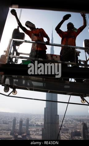 Window cleaners at work on Burj Khalifa, the world's tallest building ...