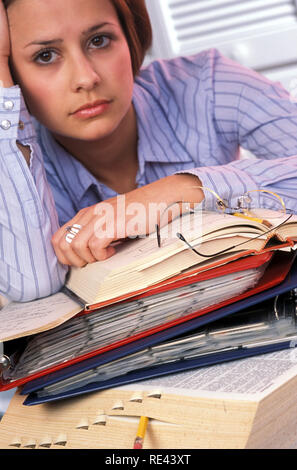 Pretty college student has lots of homework, USA Stock Photo - Alamy