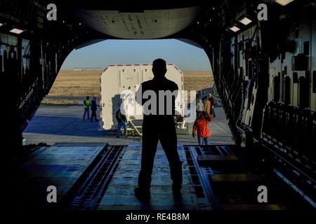 Members from Lockheed Martin prepare the loading ramp of a C-17 ...