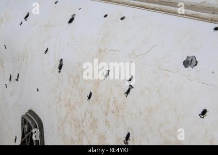 A truck peppered with holes from the tungsten steel pellets from the ...