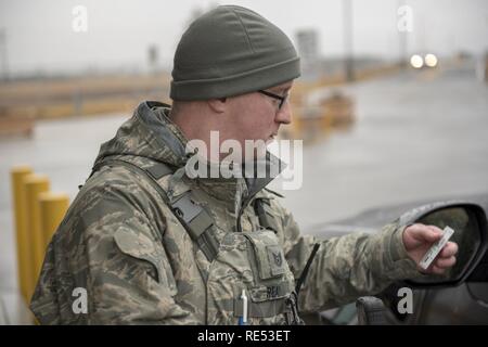 Technical Sgt. Wayne Reay of the 102nd Security Forces Squadron checks ...