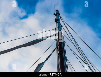 A traditional wooden gaff rigged sailing dinghy at Brightlingsea ...