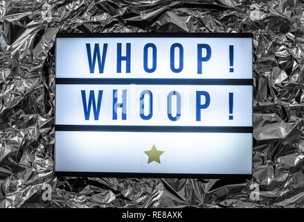 Text Whoop on white illuminated board. Conceptual message for ...