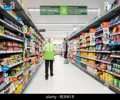 Female Asda worker stacking shelves in Asda supermarket. UK Stock Photo ...