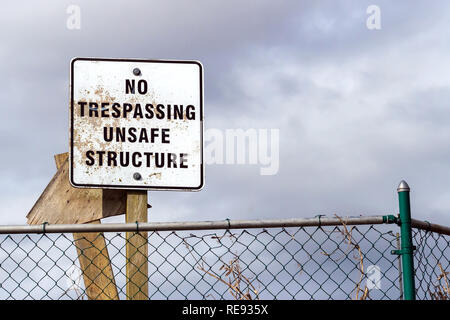 Danger unsafe structure warning sign attached to red brick wall Stock ...