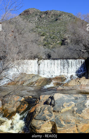 The mountain water runoff flows to the Sabino Canyon Dam in the desert ...
