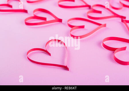red heart shape on ping background Stock Photo - Alamy