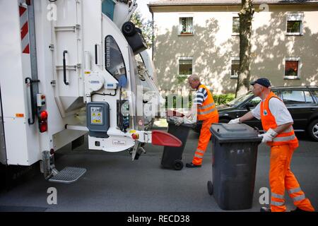 Germany, garbage collection, men, bins, emptying, garbage truck, detail ...