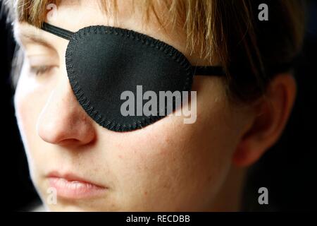 Woman with black eye patch Stock Photo - Alamy