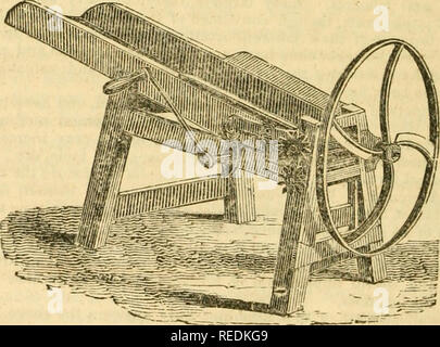 A threshing machine in operation on a field. Thresher are used for the ...