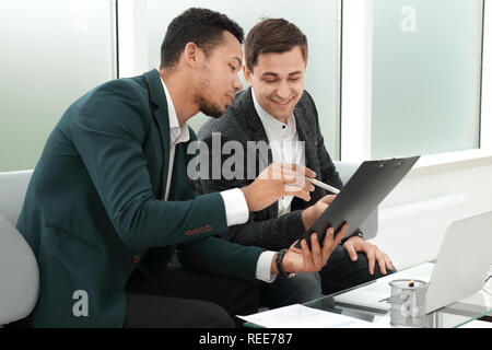 business partners discussing contract terms in office .business concept ...