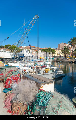 Saint-Tropez fisher port with fishing traditional boats called "pointus ...