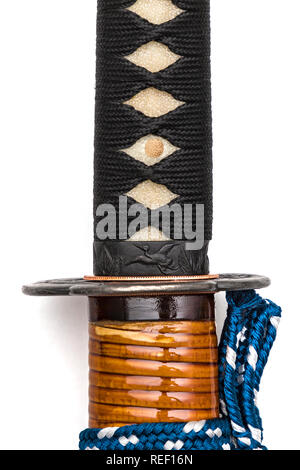 Tsuka - handle of Japanese sword wrapped by black silk cord on white ...