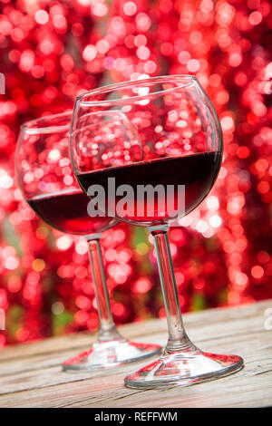 wooden christmas decoration against defocused garland lights background ...