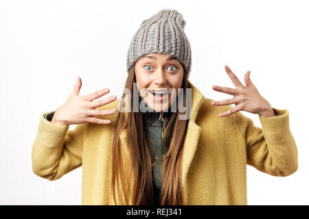 Shoked surprised beautiful bug eyed woman in warm clothing Stock Photo ...