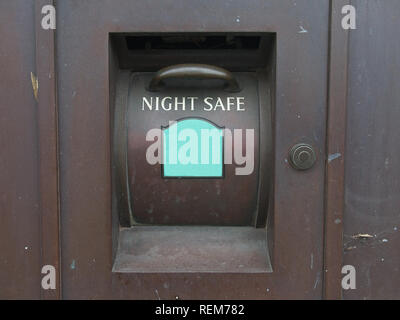 Night safe deposit box on outside wall at a Lloyds country bank Stock ...
