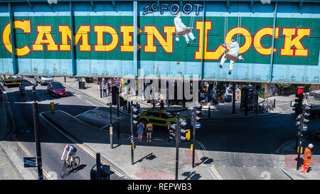 Mural of painters painting Camden Lock on railway bridge Camden Town ...