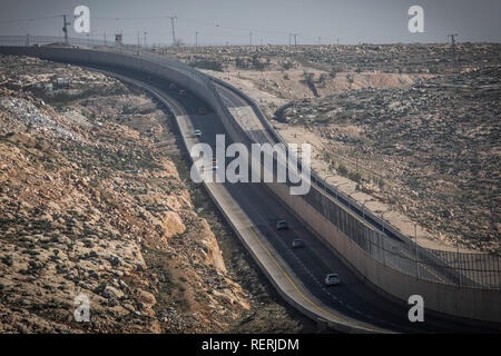 A newly opened segregated West Bank highway, right side of the wall, is ...